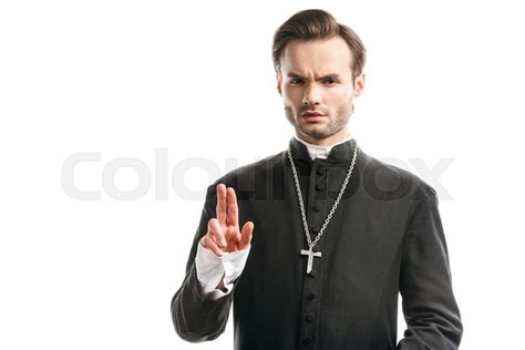 Confident Strict Catholic Priest Showing Blessing Gesture Isolated On