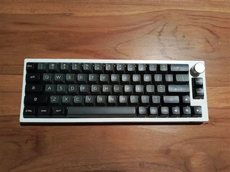 Premium Photo White Wireless Mechaical Keyboard With Black Keycaps On Wooden Table
