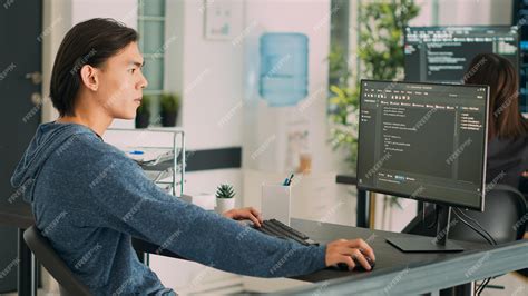 Premium Photo Asian Programer Developing Database Interface And