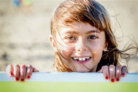 Beautiful Eight Year Old Girl Playing With The Ball On The Beach Stock