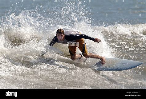 Statedailysurfs Up Surfers Hit The Water As 12 Ft Waves Crash The