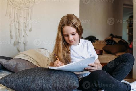The Girl After School Plays At Home Draws With Pencils And Felt Tip