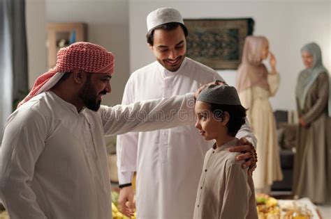 Muslim Uncle Patting His Nephew On Head Stock Image Image Of Custom Thawb 312572335