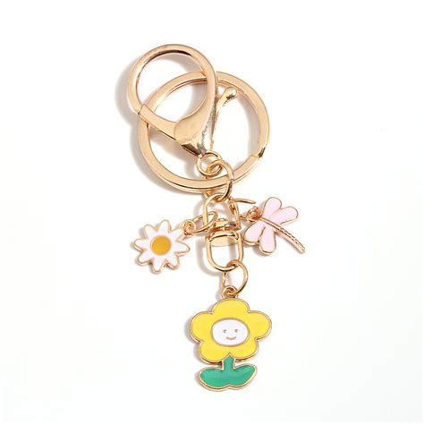 Badu Bg Карикатура Емайлиран ключодържател Малко цвете Водно конче Ключодържател Усмивка Лице