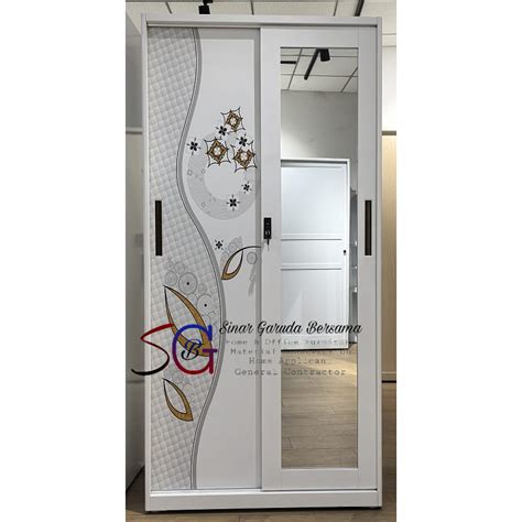 Jual LEMARI PAKAIAN SLIDING 2 PINTU PLAT BESI KACA PANJANG MOTIF DAUN