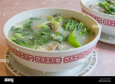 Fish Head Soup With Chinese Vegetable Parsley Tofu And Cilantro Stock