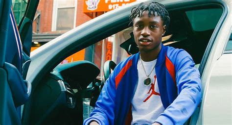 Download Lil Tjay In Fierce Pose Wallpaper