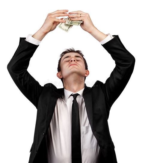 Young Businessman Holding Dollar Bills Over His Head Stock Image