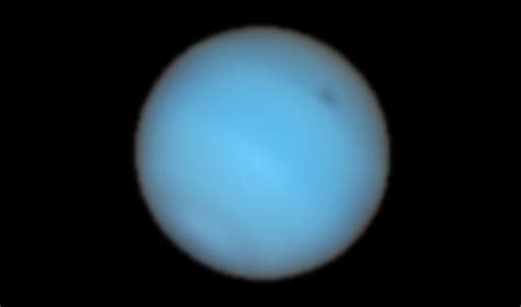 A Mysterious Dark Spot On The Planet Neptune Appears From Earth For The