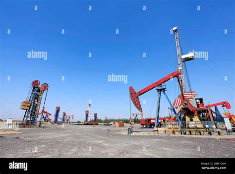 Oil Field Scene Beam Pumping Unit And Tower Type Pumping Unit In The Work Stock Photo Alamy
