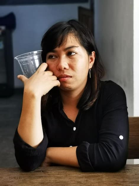 Premium Photo Young Woman Drinking Glass