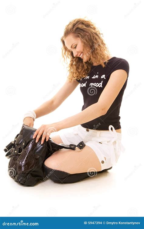 Smiley Woman Looking For Something At Her Handbag Stock Photo Image