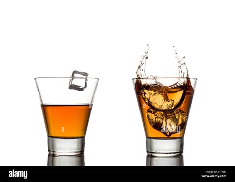 Whisky Splash In Glass Isolated On A White Stock Photo Alamy