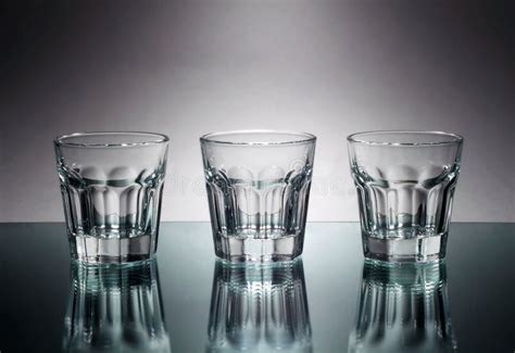 Three Vodka Glasses At Mirror Stock Image Image Of Crystal