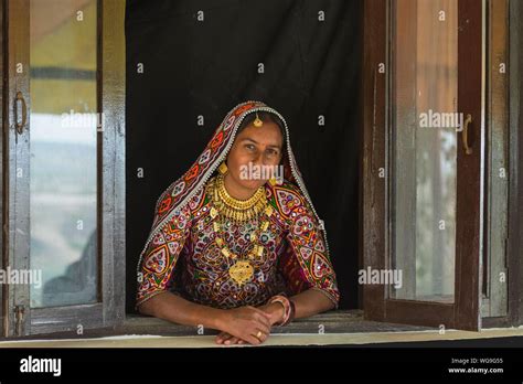 Ahir Woman In Traditional Colorful Clothes Looking Out Of A Window