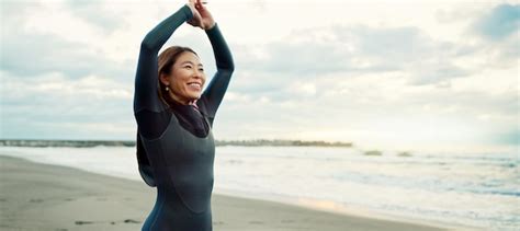 Premium Photo Surfer Japanese And Woman Stretching At Beach Happy For