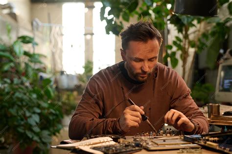 Premium Photo Caucasian Man Assembling Computer Using Old Components
