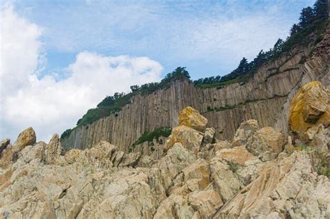 Premium Photo Coast Of Kunashir Island On Cape Stolbchaty With Basalt