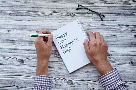 Premium Photo Man Writing In A Notebook Happy Left Handers Day Text