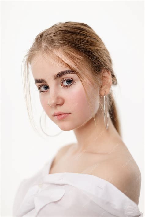 Cute Thoughtful Caucasian Teen Model Wearing Shirt Posing With Bare