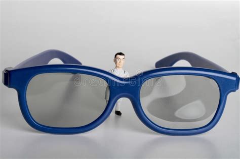 Miniature Figurine Of An Optician Doctor With A Giant Pair Of