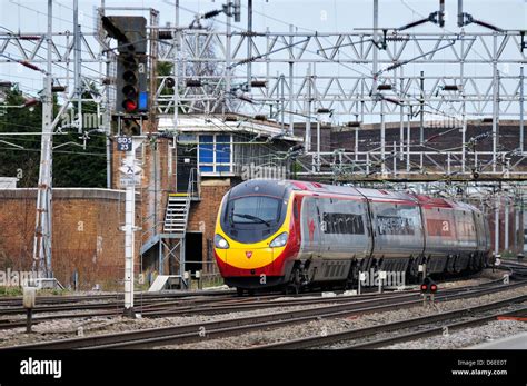 Virgin Pendolino Train Arriving At Stafford Railway Station Stock Photo Alamy