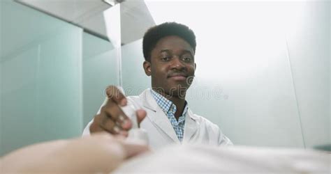Doctor Obstetrician Gynecologist At His Desk In The Background Close