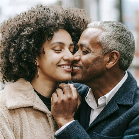 Premium Photo Woman Kissing Happy Husband On Cheek