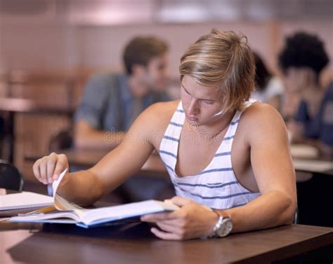 University Reading And Man In Library With Books For Studying Learning And Research With