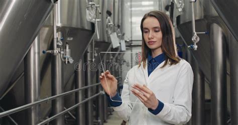 Crop View Of Female Process Engeneer Touching Blank Display While Entering Data And Standing At