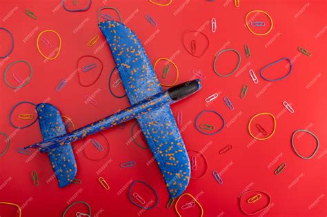 Premium Photo Toys And Aircraft Blue Plane On A Red Background