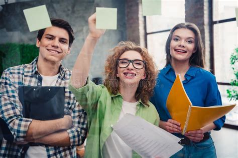 Group Of Young Professionals Collaborating In A Bright Office Space With A Positive And