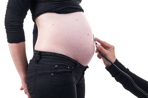Pregnant Woman Being Examined By A Doctor With A Stethoscope Iso Stock