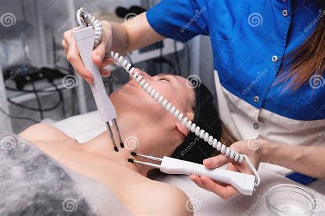 Young Middle Aged Caucasian Woman Receiving Electrical Stimulation
