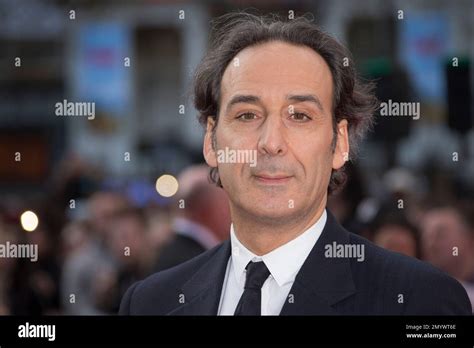 Composer Alexandre Desplat Poses For Photographers At The Premiere Of