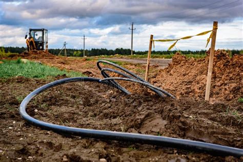 Laying A Fiber Optic Cable For Fast Internet Electricity And Telephone