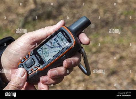 Garmin Gpsmap Handheld Gps Unit Held In Hand Stock Photo Alamy