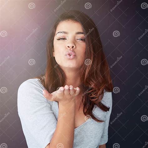 Heres A Kiss For You Cropped Portrait Of A Beautiful Young Woman
