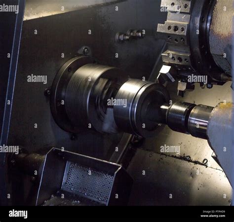 CNC Lathe Pulls Out Part Of Metal Workpiece Pulley Modern Lathe For Metal Processing Close Up