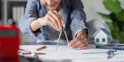 Architect Using A Compass For Precise Blueprint Design In Construction Planning Stock Image