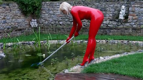 Blonde S In Red Latex Catsuit Works And P Outdoor In The Garden