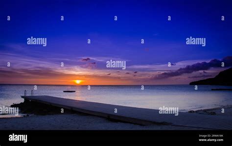 Outstanding Sunset At The Porto Mari White Sandy Beach With Blue Sky