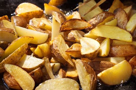 Pieces Of Potatoes Are Fried In Boiling Oil Cooking Process The