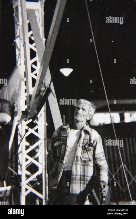 Fine 70s Vintage Black And White Lifestyle Photography Of A Carnival Ferris Wheel Operator Stock