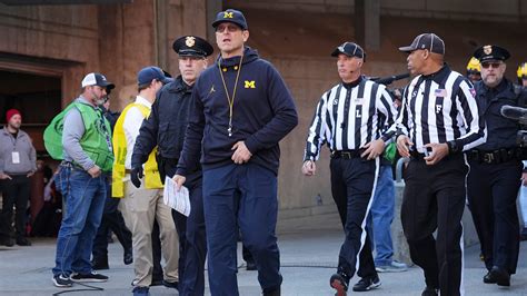 Michigan Football Coach Jim Harbaugh Helps Ann Arbor Police Move Tree