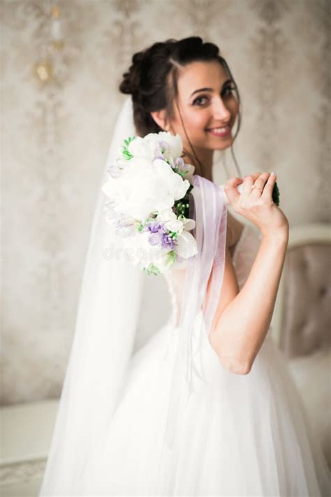 Luxury Bride In White Dress Posing While Preparing For The Wedding