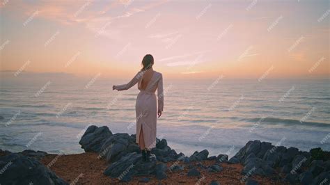 Premium Photo Slim Lady Standing Rocks Looking Calm Ocean Alone Back