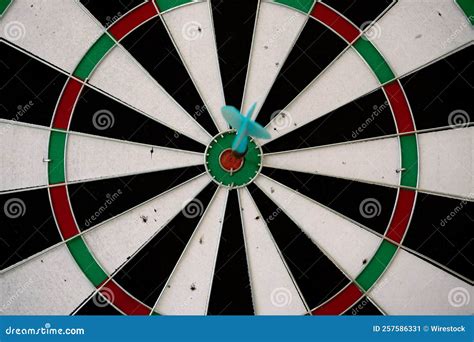 Closeup Of A Dart Game With The Arrow On The Center Target Stock Image