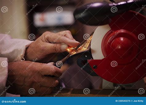 Sharpening A Chisel On A Grinding Wheel Stock Image Image Of
