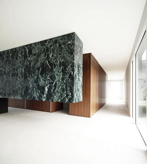 Monolithic Marble Partition Divides Antwerp Penthouse